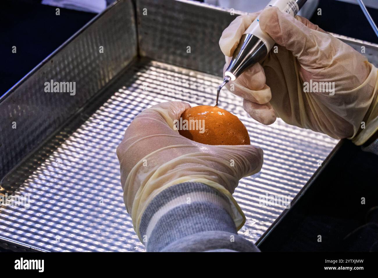 A woman trains using a frequency modulated ultrasound bone surgery ...