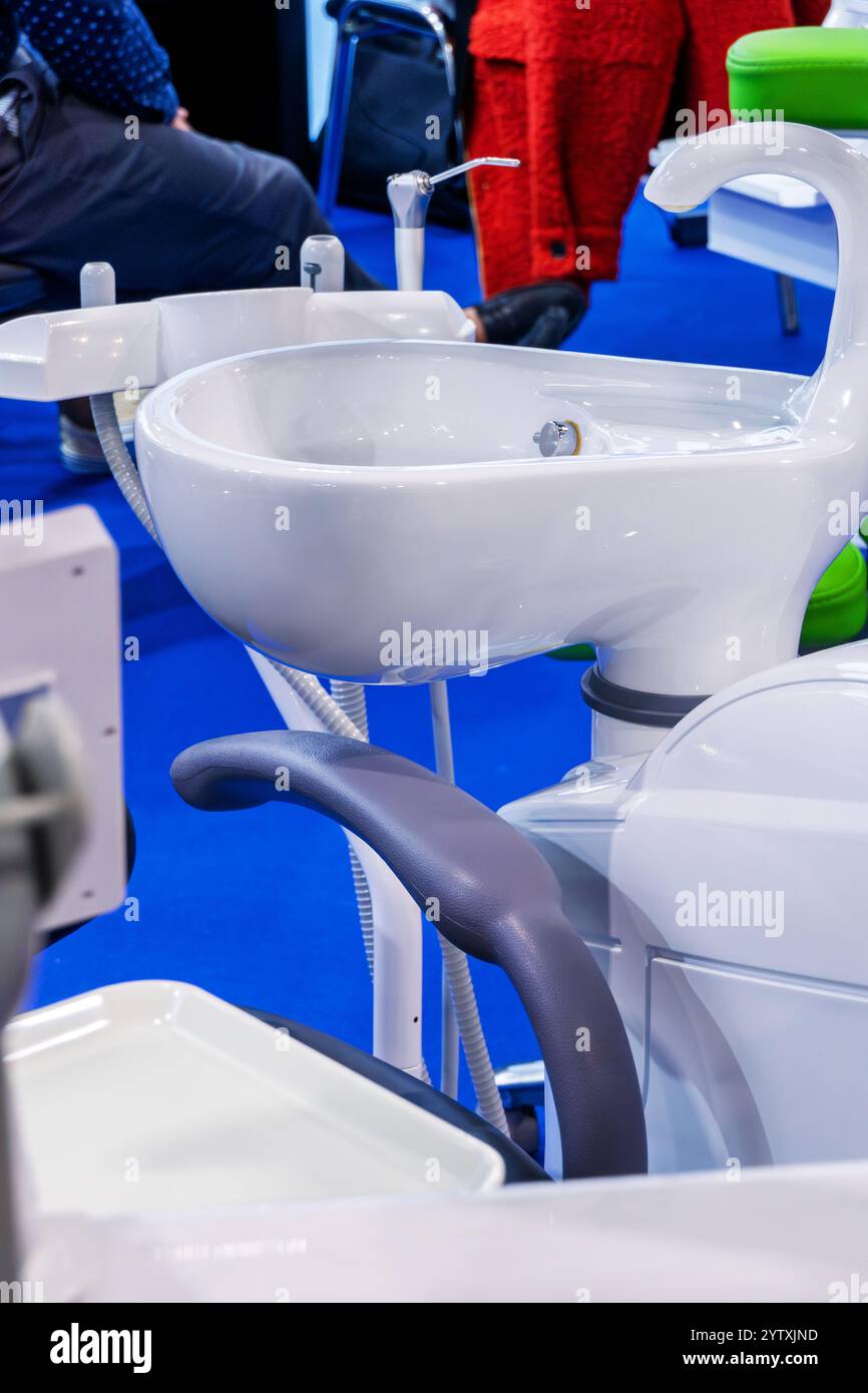 Dental chair with spittoon for patients Stock Photo - Alamy