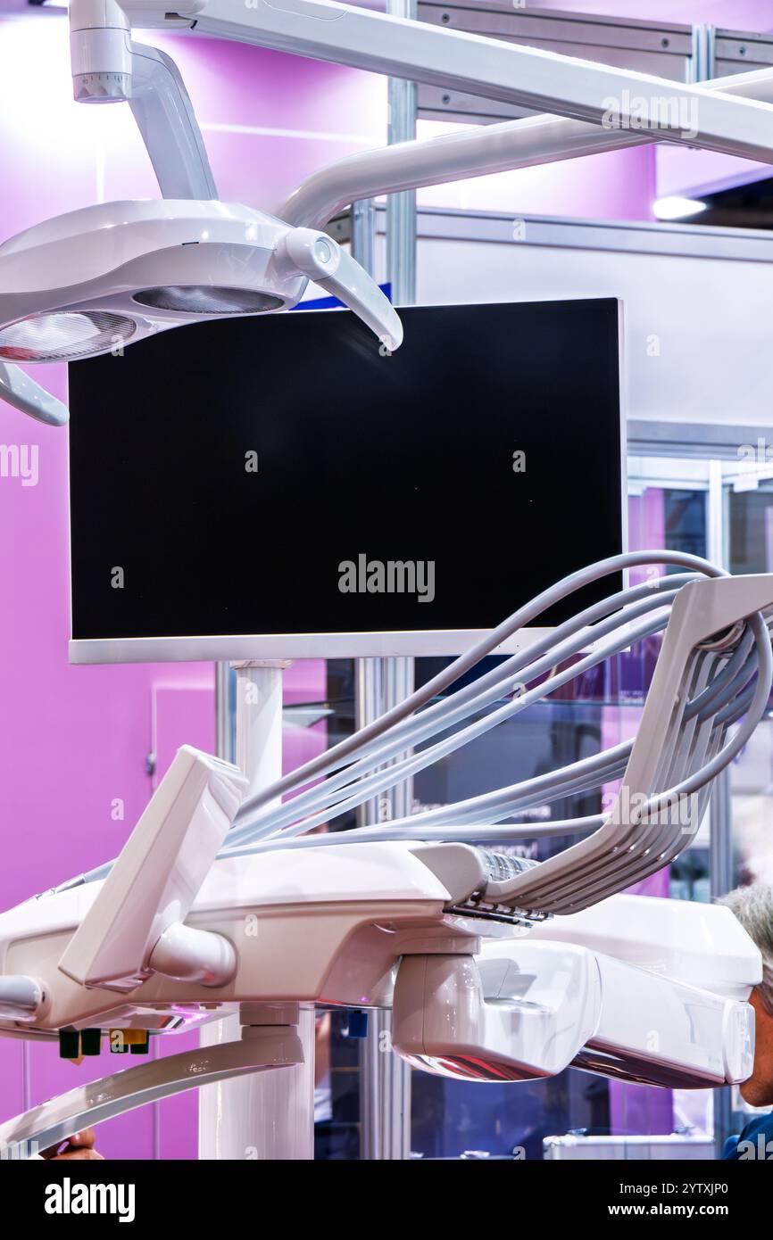 Large monitor for dental microscope among dental unit Stock Photo - Alamy