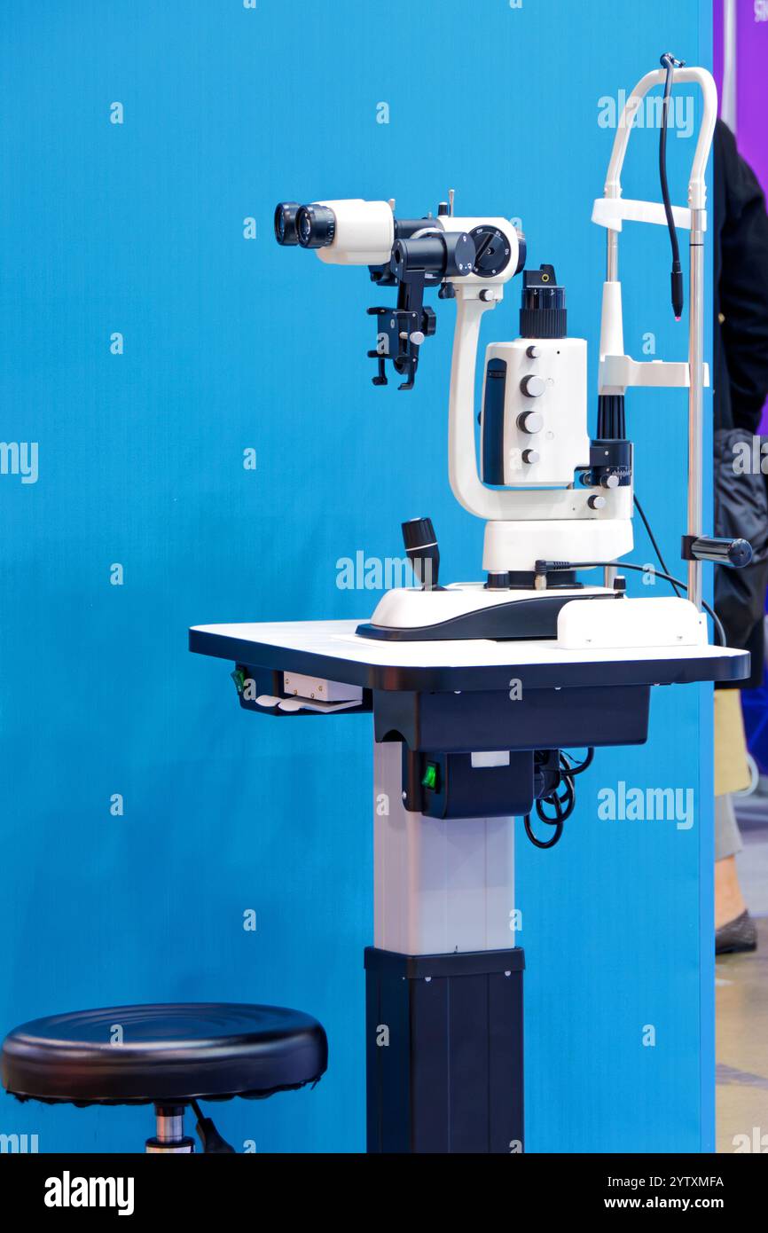 Slit lamp with table for biomicroscopic examination of the anterior ...