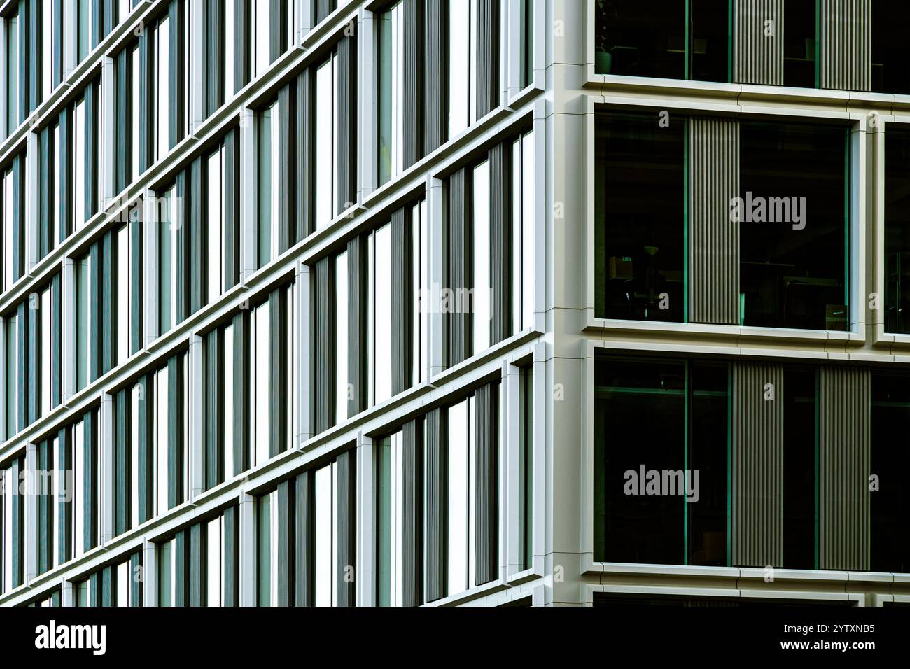 Contemporary Office Building Facade with Vertical Panels and Large ...