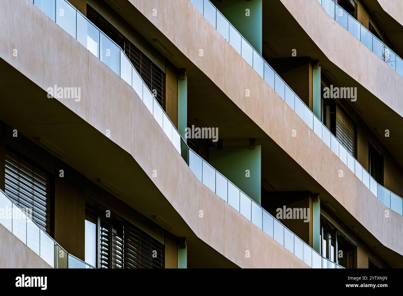 Modern Residential Building with Spacious Balconies and Glass Railings ...