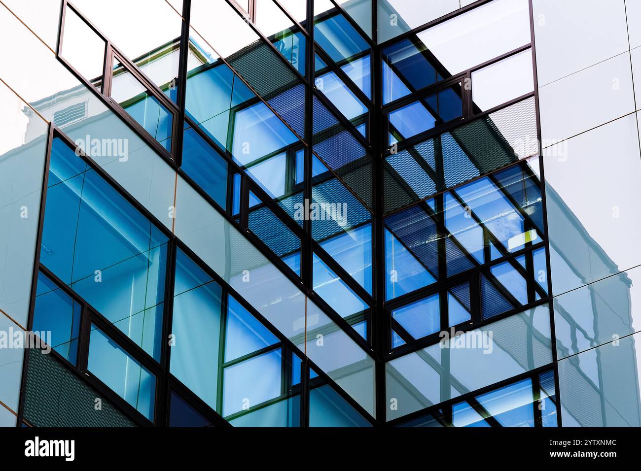 Modern Office Building Facade with Geometric Glass Windows and Contemporary Architectural Design ...