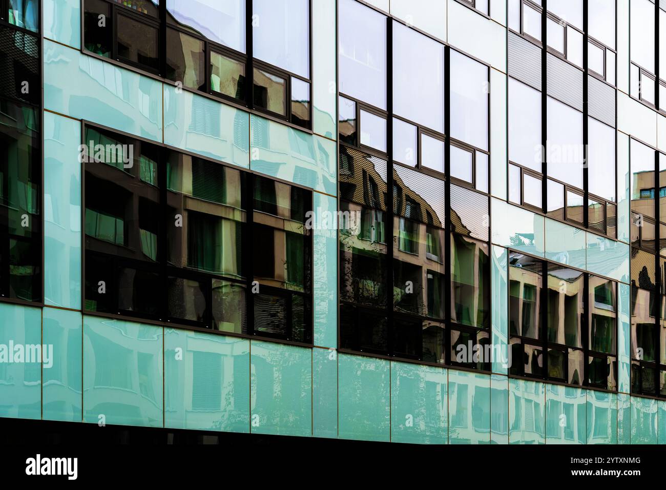 Modern Glass Facade with Reflective Panels and Angular Architectural ...