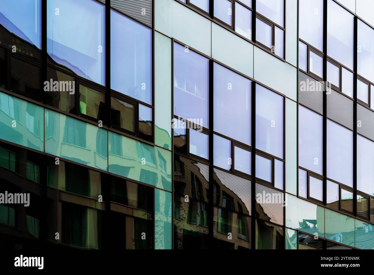 Modern Glass Facade with Reflective Panels and Angular Architectural ...