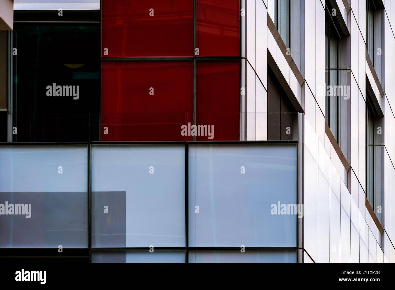 Modern Building Facade with Red and White Panels and Reflective Glass ...