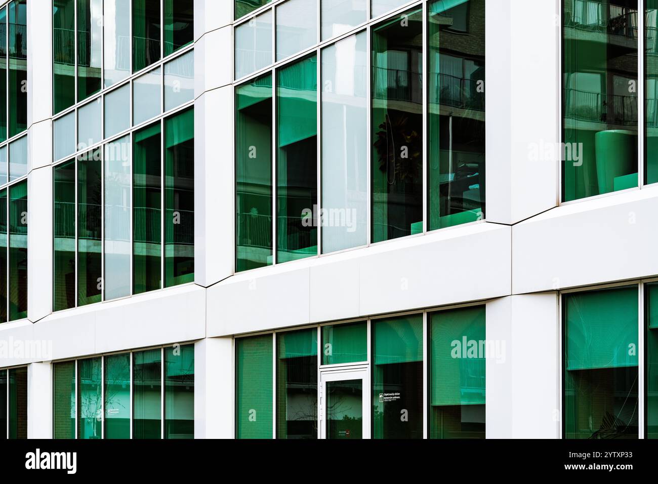Modern Glass Facade with Reflective Panels and Angular Architectural ...