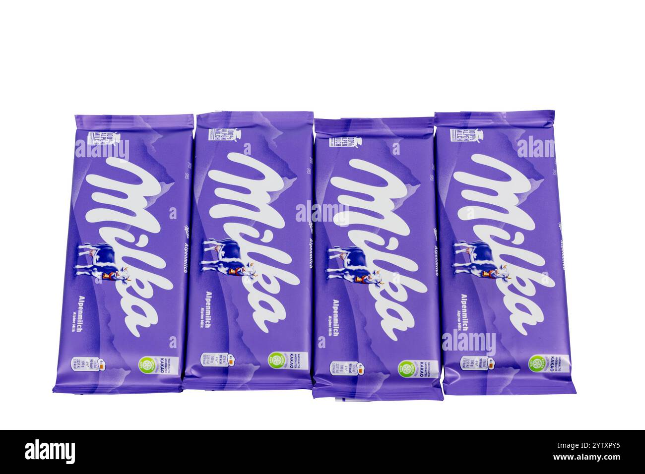 Germany Berlin December 7, 2024. Four purple Milka chocolate bars. The ...