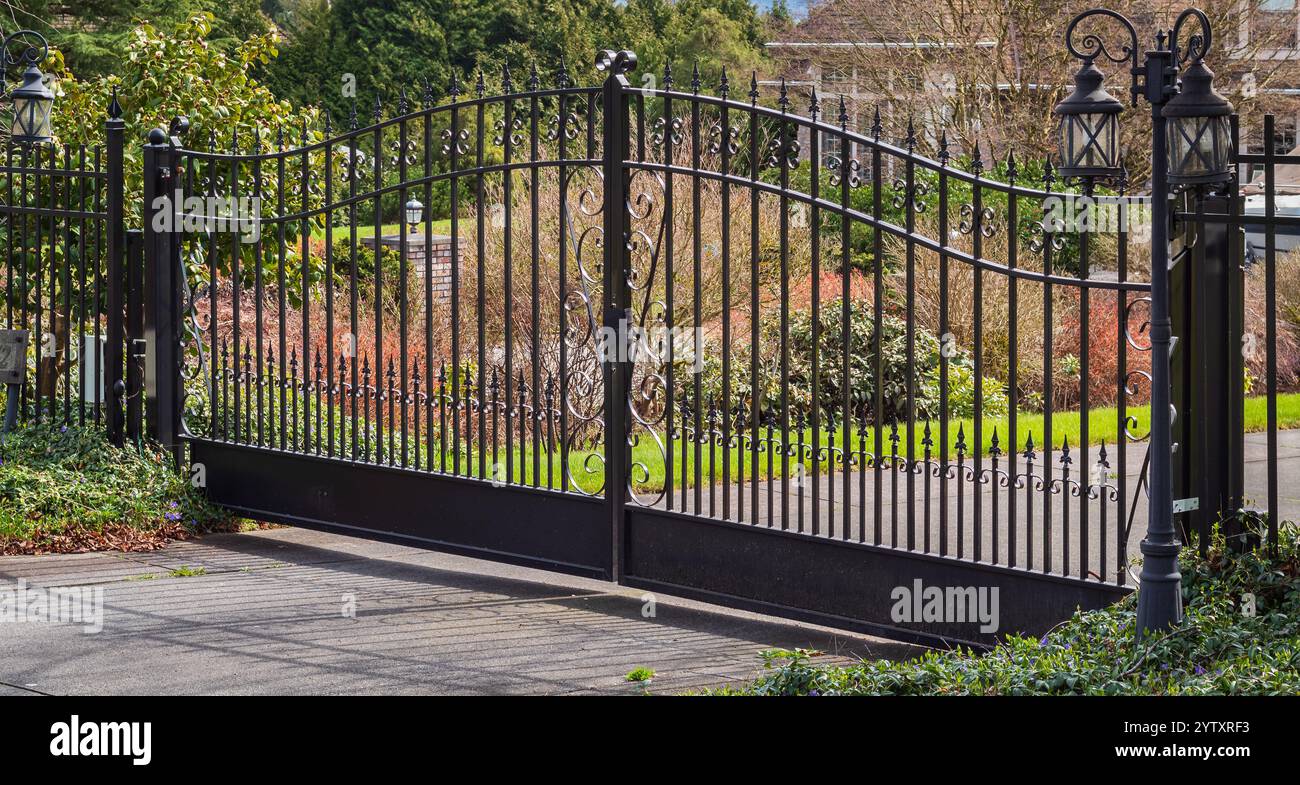 Metal fence gate of a luxury home. Heavy duty metal front gate. Wrought ...