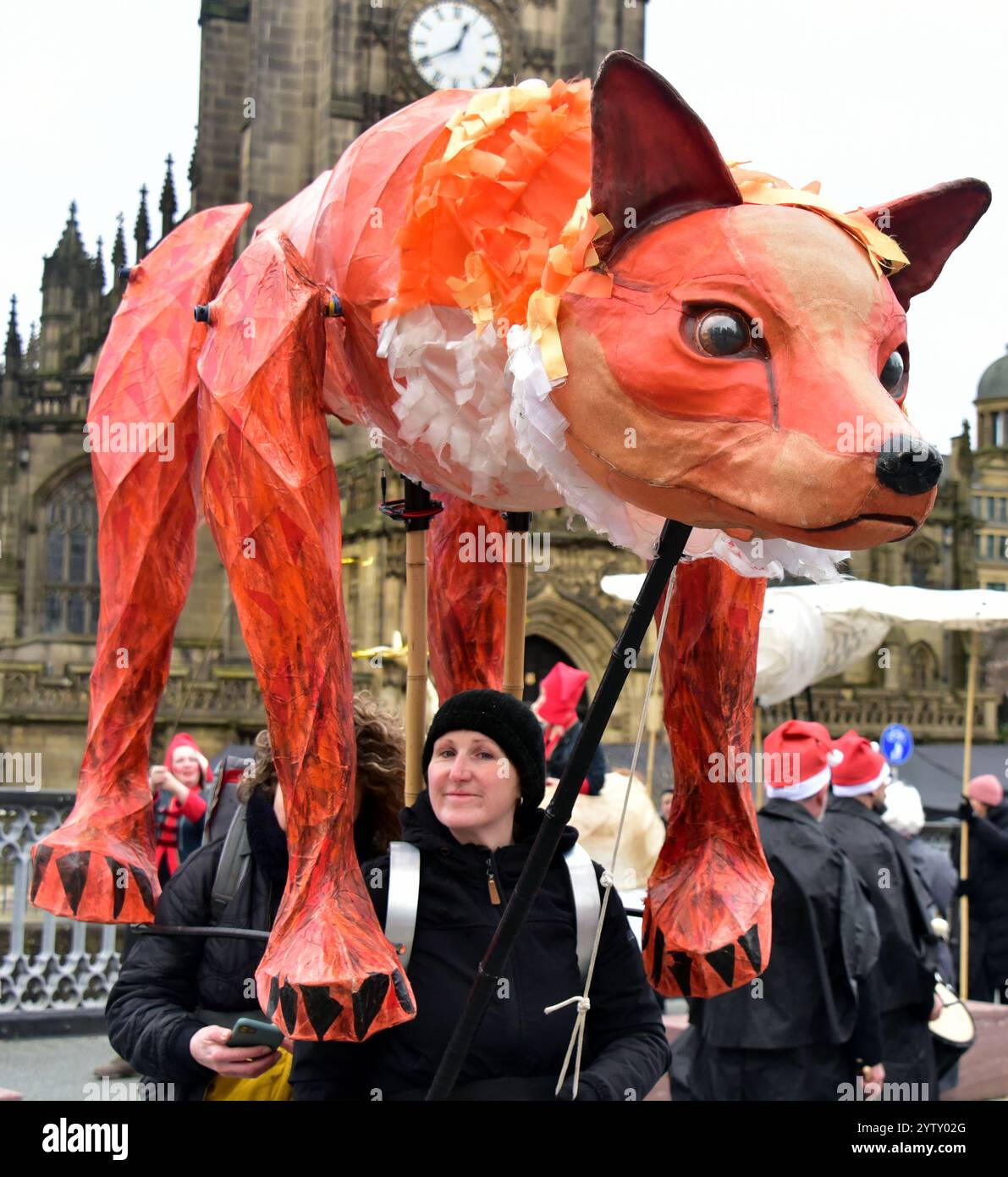 Manchester, UK, 8th December, 2024. Colourful, festive participants in ...