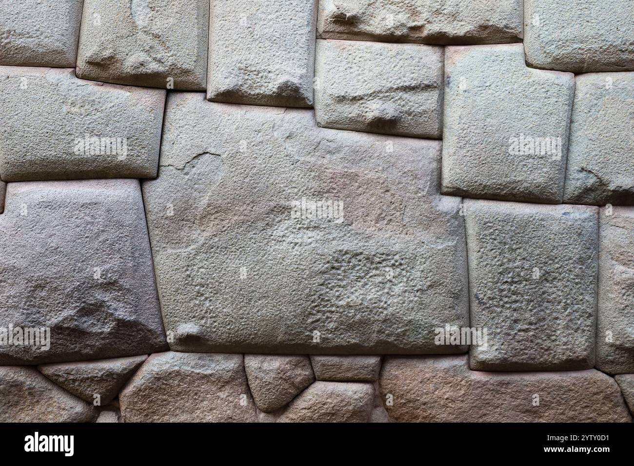 A carved, complex wall stone with twelve corner points on a street in ...
