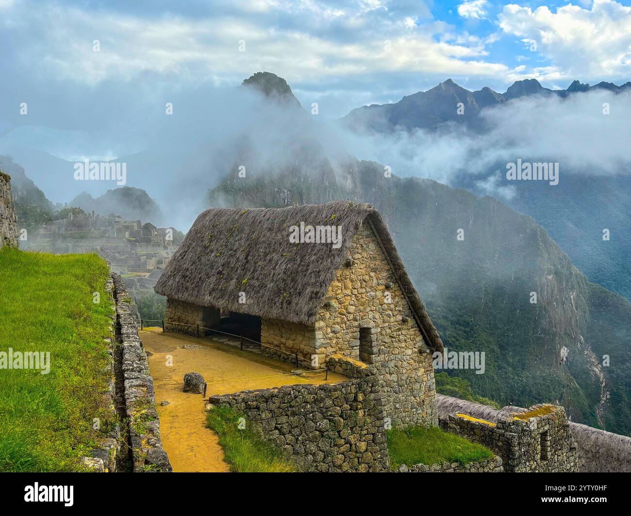 Machu Picchu Hut Under Under Blue Sky and Dramatic Clouds in the ...