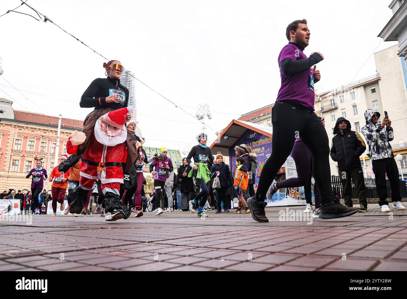 Zagreb. 8th Dec, 2024. People take part in the Advent run event in ...