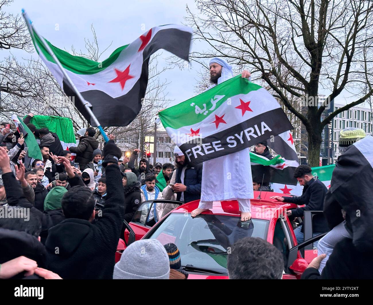 People celebrate the fall of the Assad regime after the Syrian ...