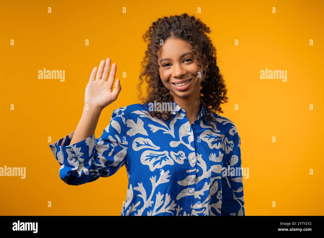 Friendly african eoman waving hi-res stock photography and images - Alamy