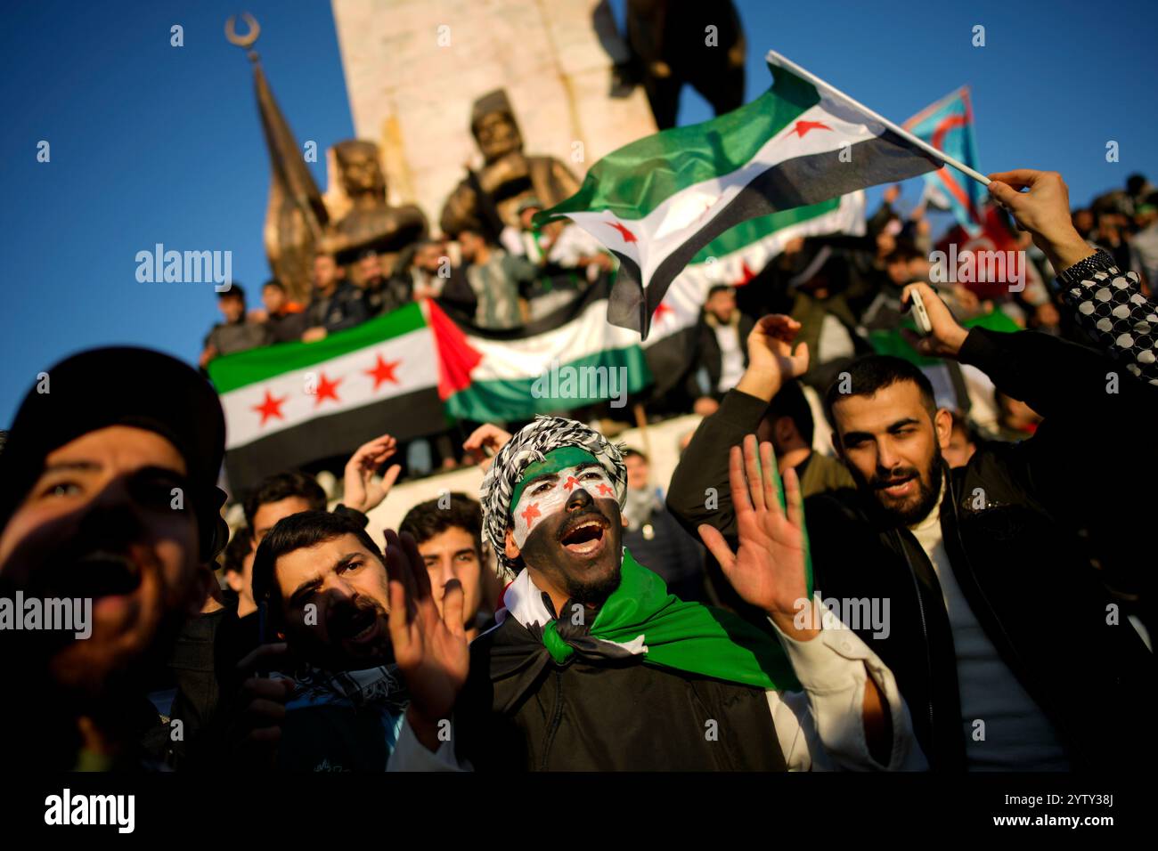 People gather to celebrate the Syrian government fall, in Istanbul ...