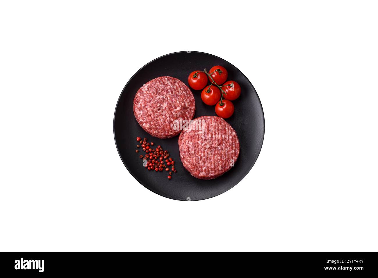 Fresh raw ground beef burger patty with salt and spices on a white ...