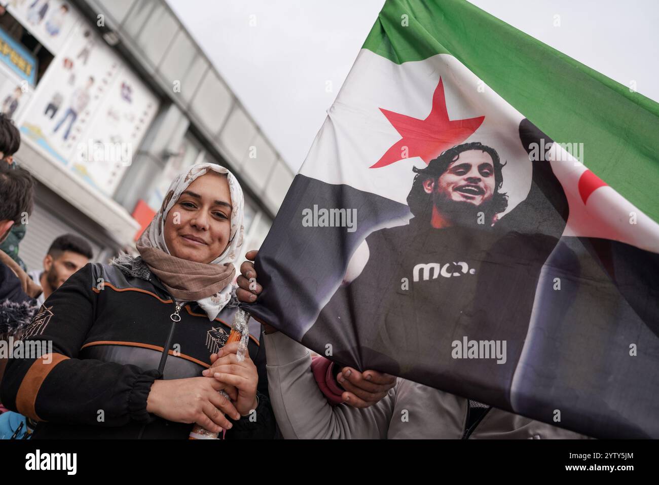 Ankara, Turkey. 08th Dec, 2024. A Syrian woman celebrates in the street ...