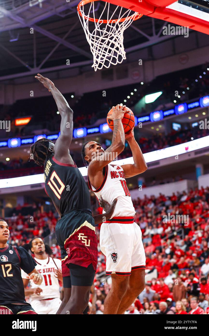December 7, 2024: North Carolina State senior Marcus Hill (10) goes up ...
