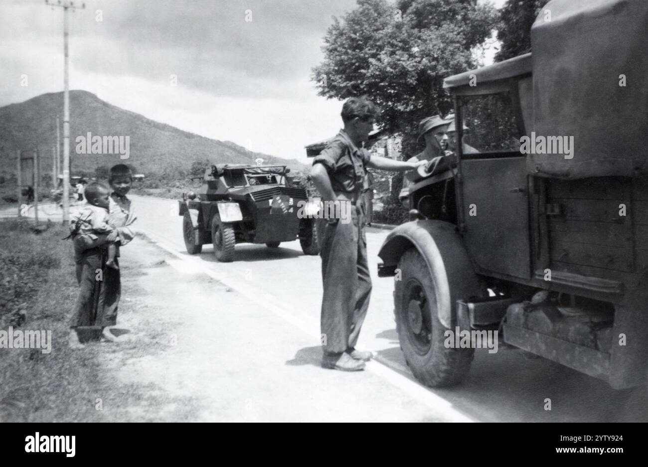 British soldiers with a truck and a Daimler scout car in Hong Kong, c ...