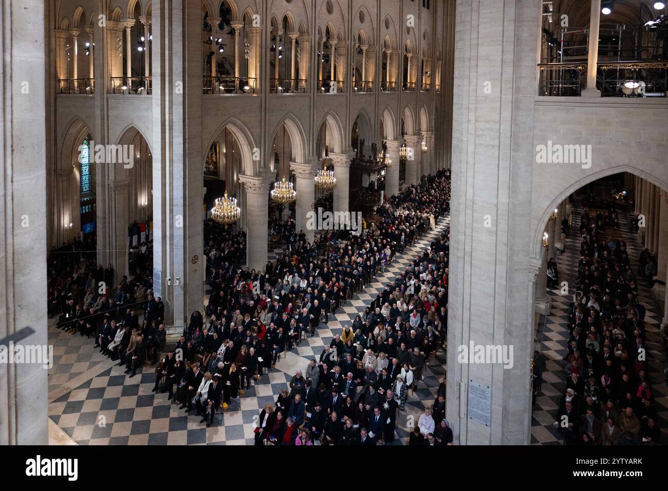 Devotees gather during the consecration of the new main altar, as ...