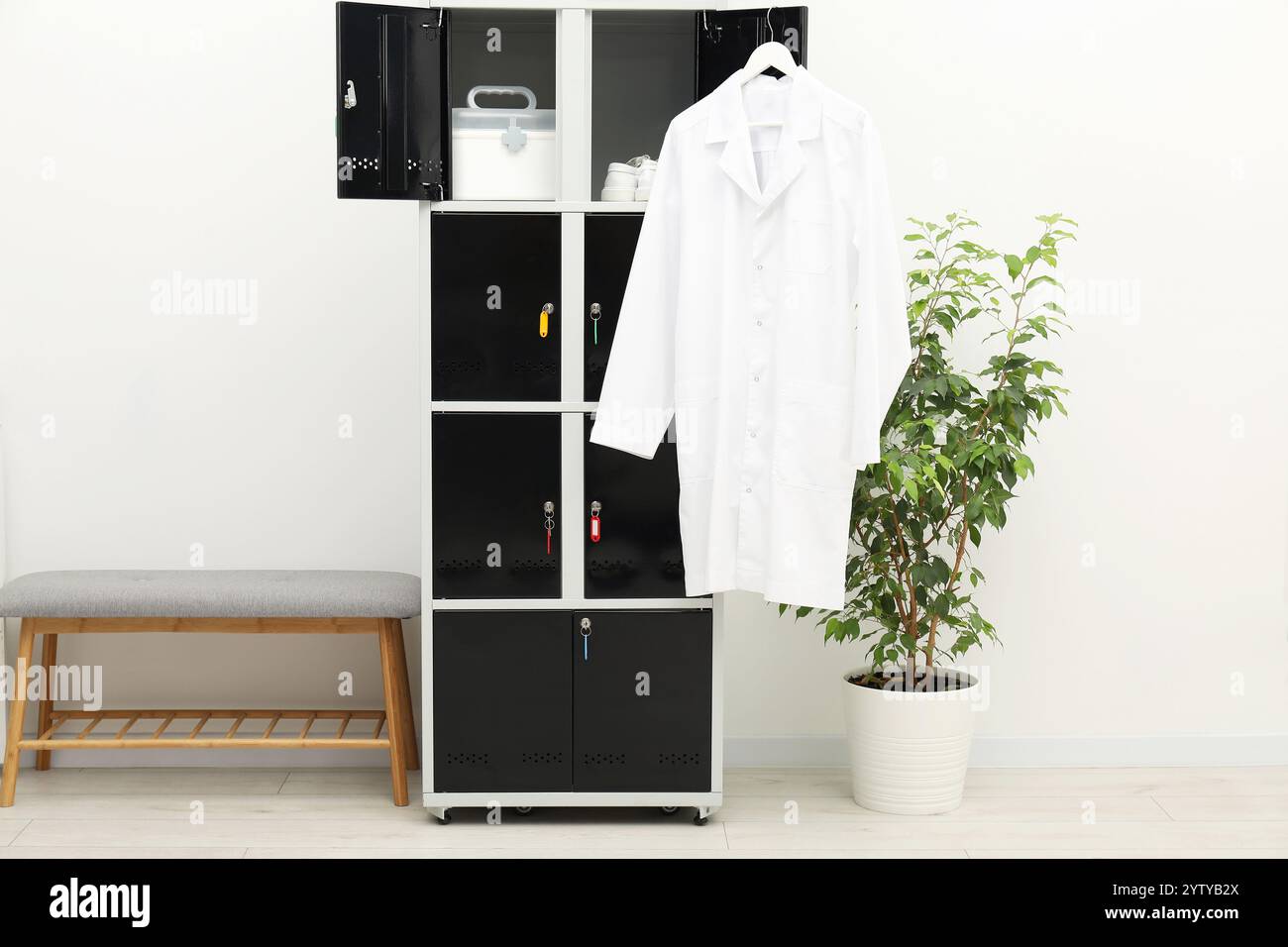 Medical personnel uniform on locker in changing room Stock Photo - Alamy