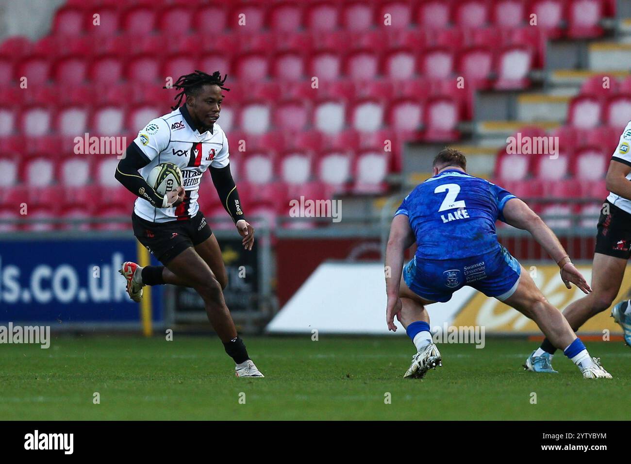 Llanelli, UK. 8 December, 2024. Rabz Maxwane of Lions takes on Dewi ...