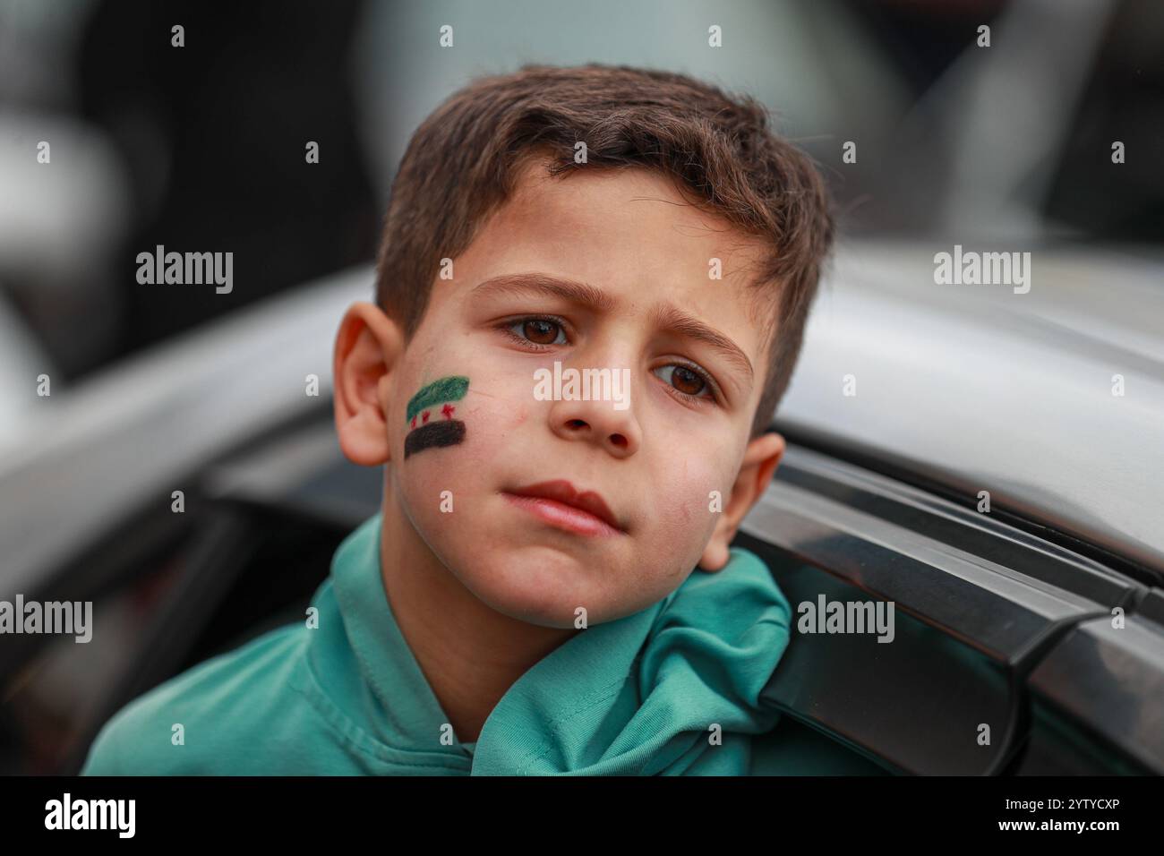 Ankara, Turkey. 08th Dec, 2024. A Syrian boy with the new Syrian flag ...