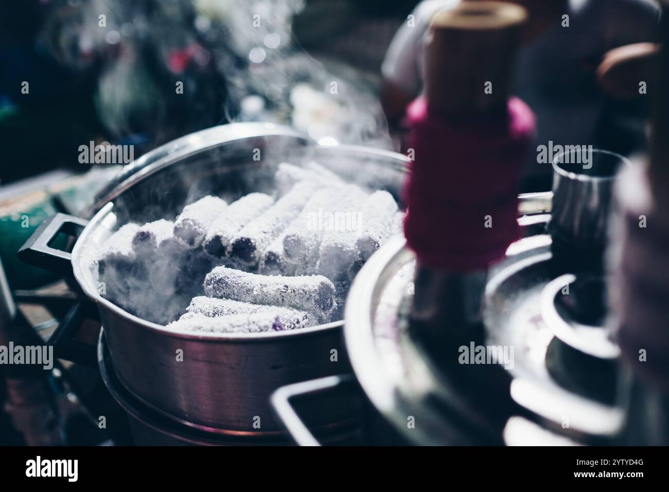 Casserole pot of grated coconut coated Puto bumbong, popular Filipino ...