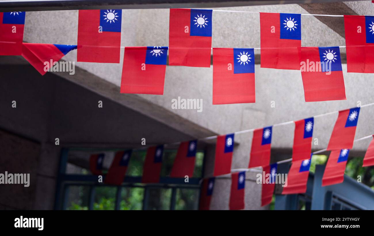 Taiwan flags fluttering in a public space, symbolizing unity and ...