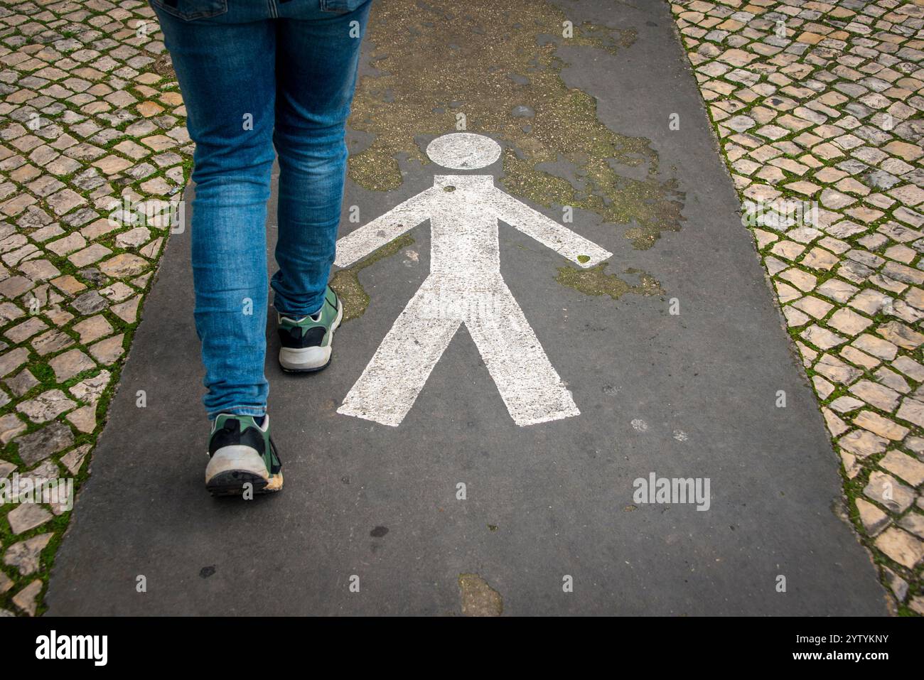footpath with painted symbol on walkway Stock Photo - Alamy