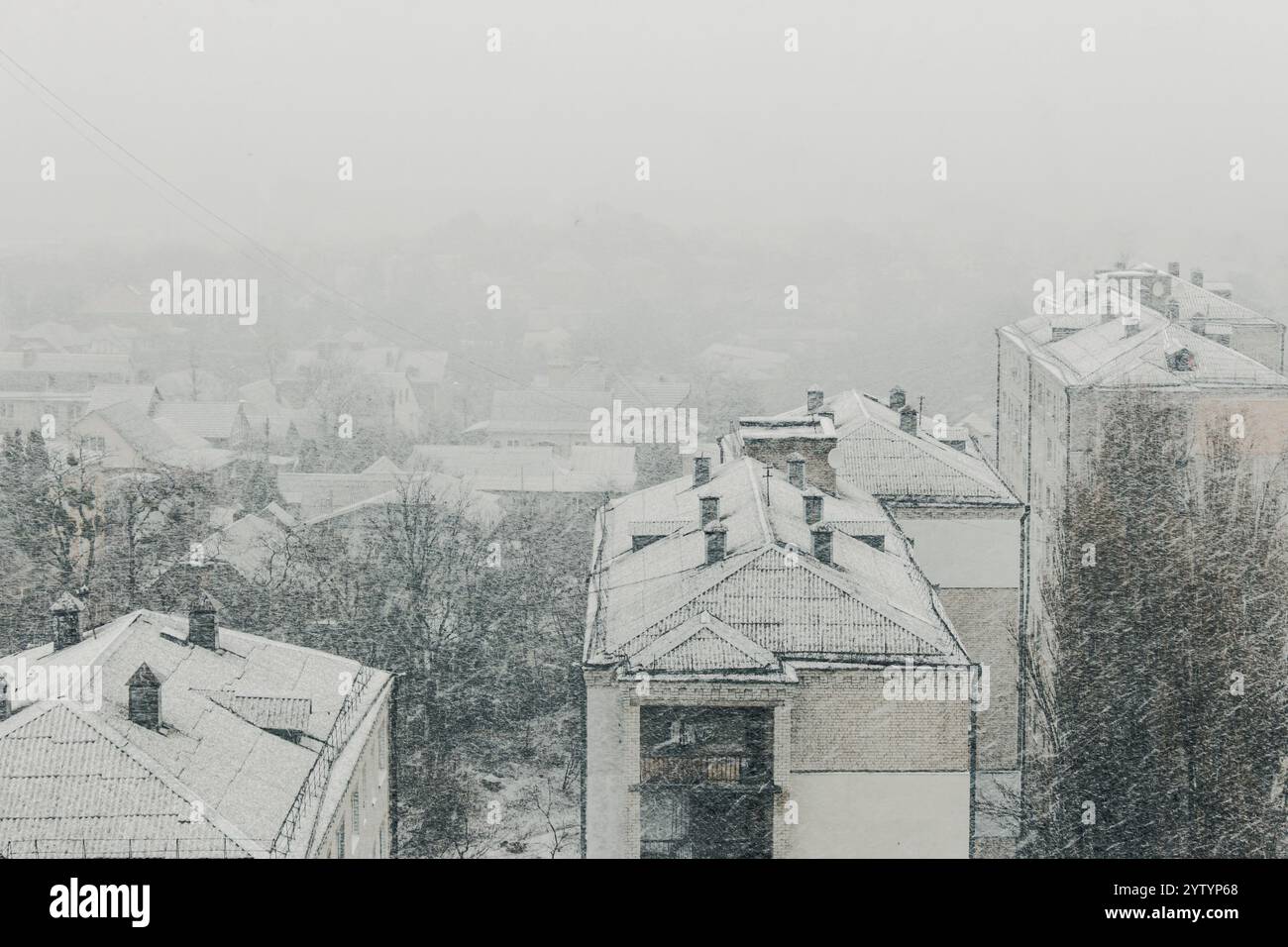 Snowfall in the city. Snow falling on roof top. Winter Kyiv landmark ...