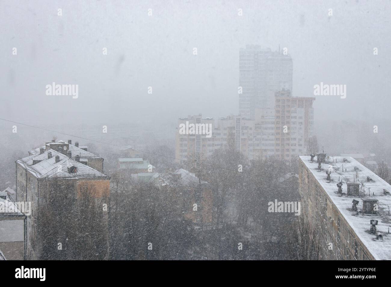 Snowfall in the city. Snow falling on roof top. Winter Kyiv landmark ...