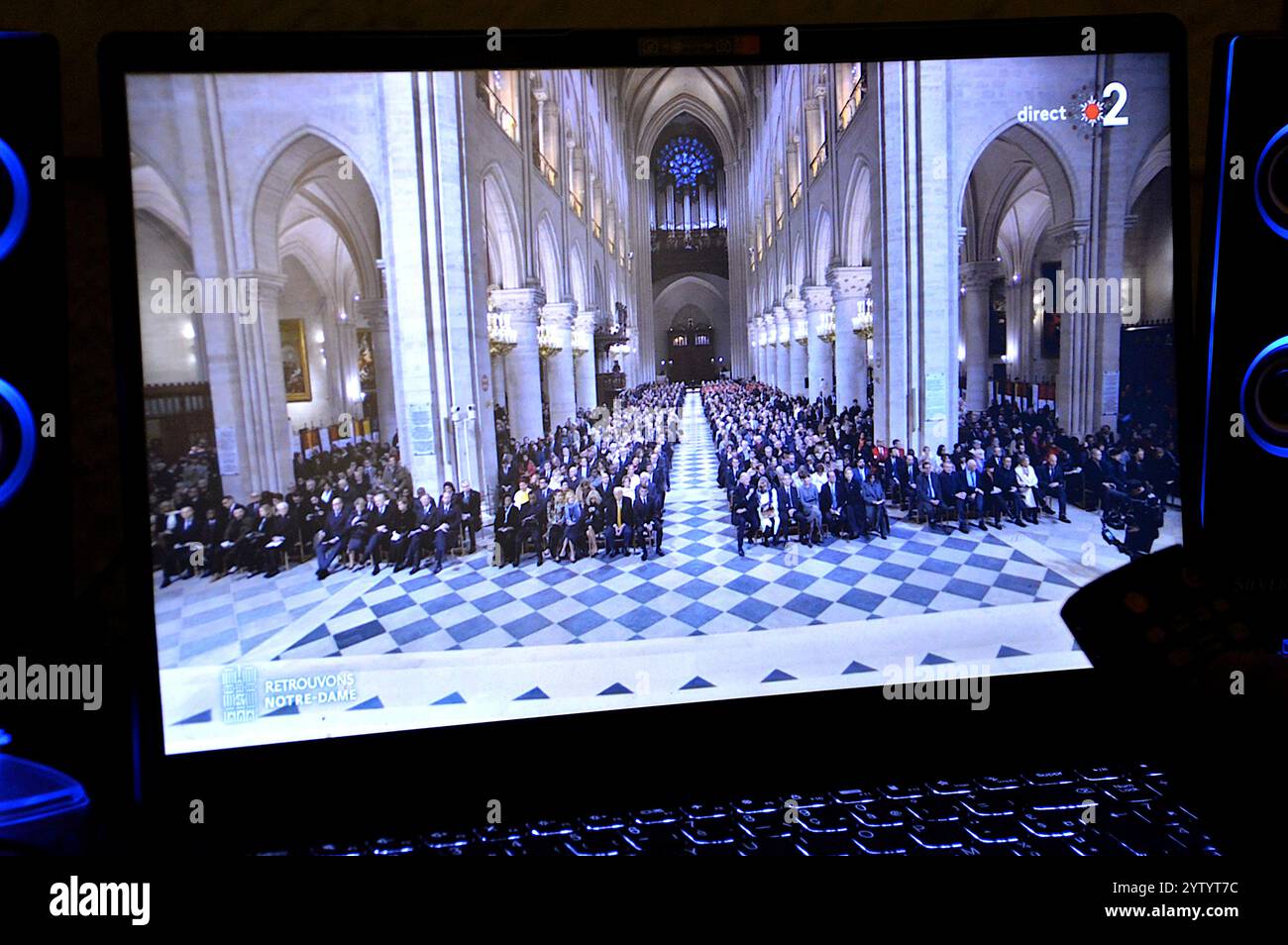 Paris, France. 07th Dec, 2024. A man watches the reopening ceremony of ...