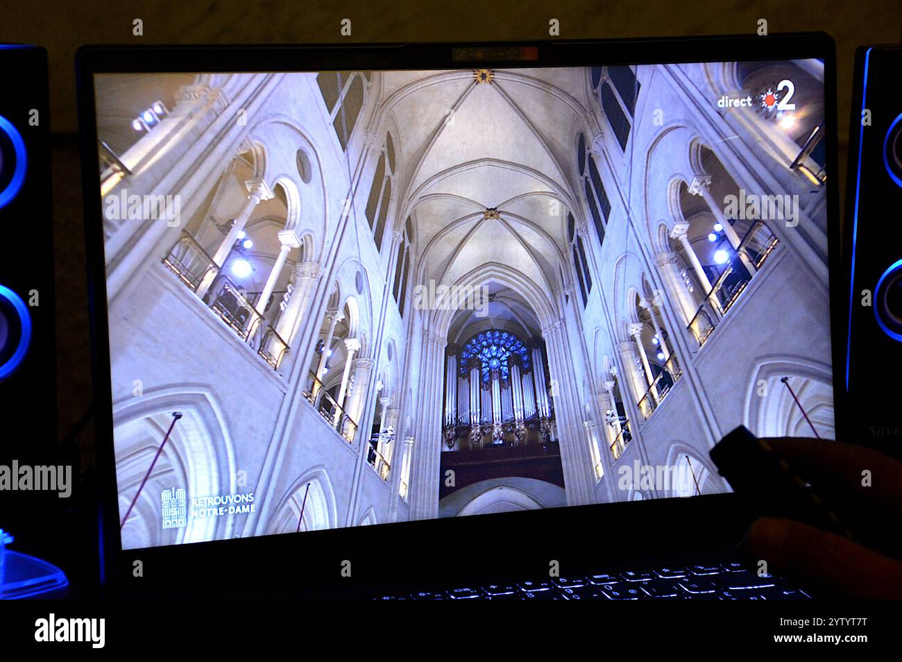 Paris, France. 07th Dec, 2024. A man watches the reopening ceremony of Notre Dame Cathedral in ...