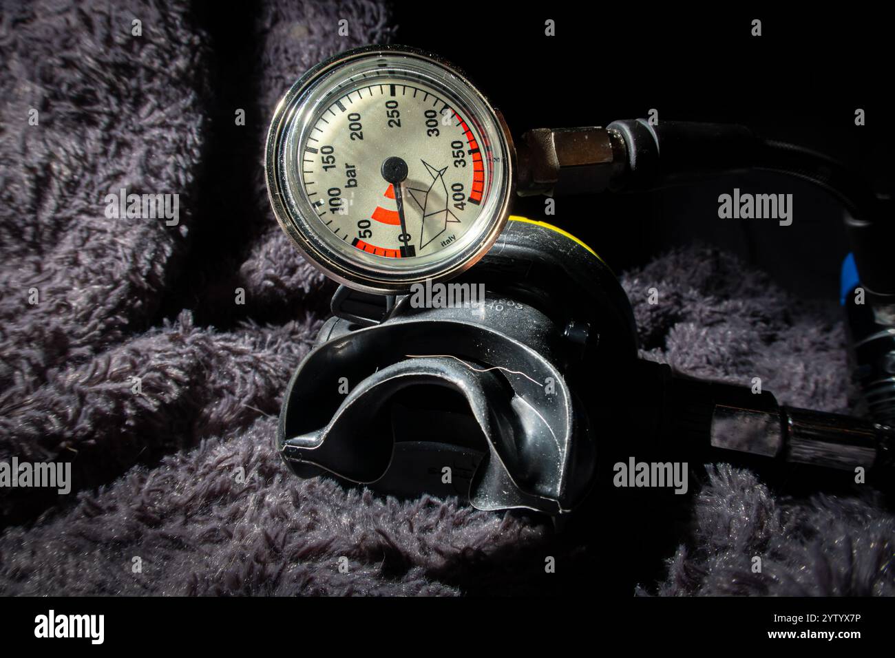 Scuba diving pressure gauge and a second stage air regulator close up ...