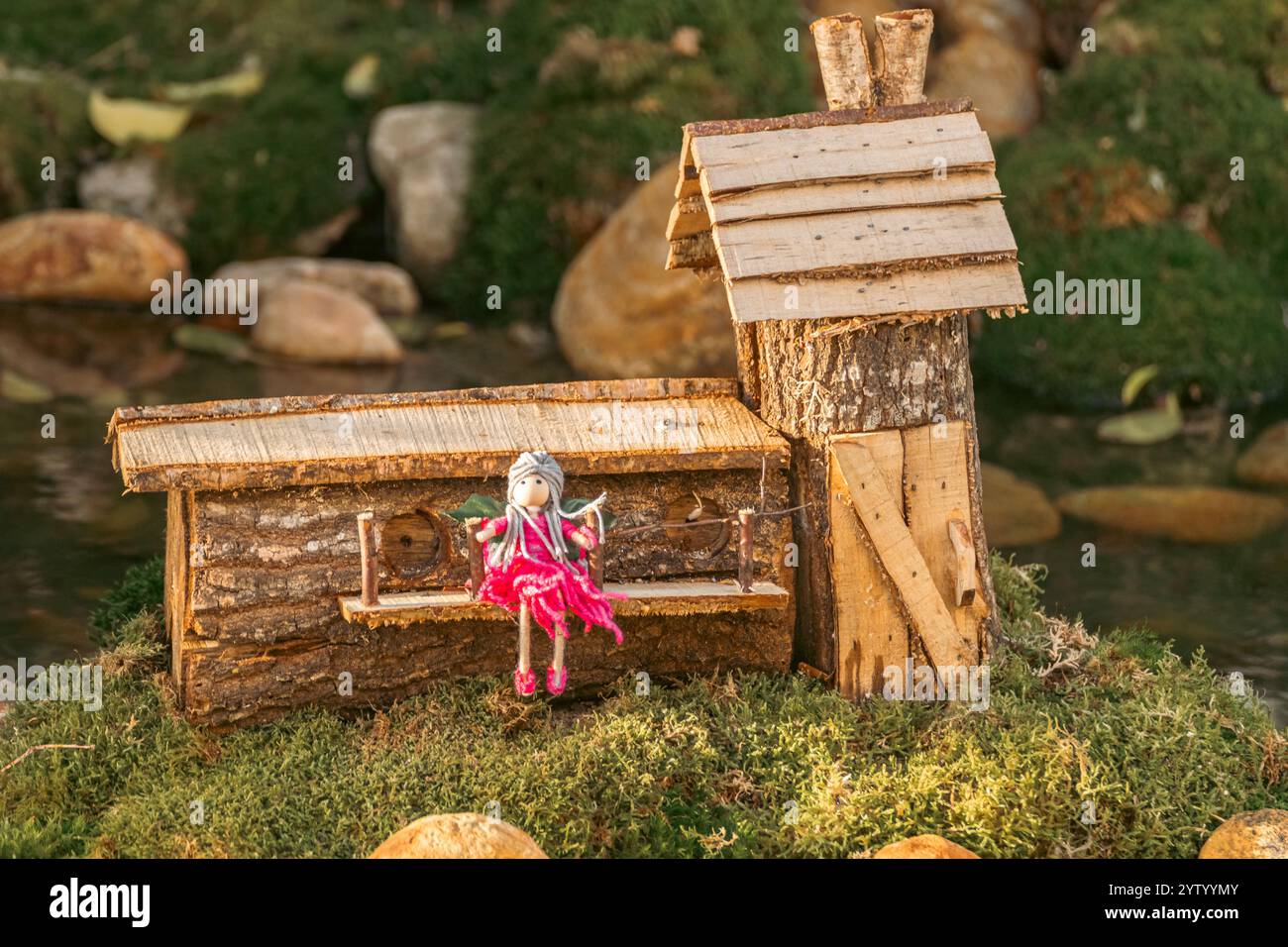 handmade toy house of a fairy made in the trunk of a tree for christmas ...
