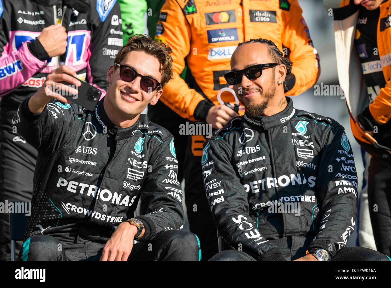 Abu Dhabi, UAE. 08th Dec 2024. George Russell and Lewis Hamilton of ...