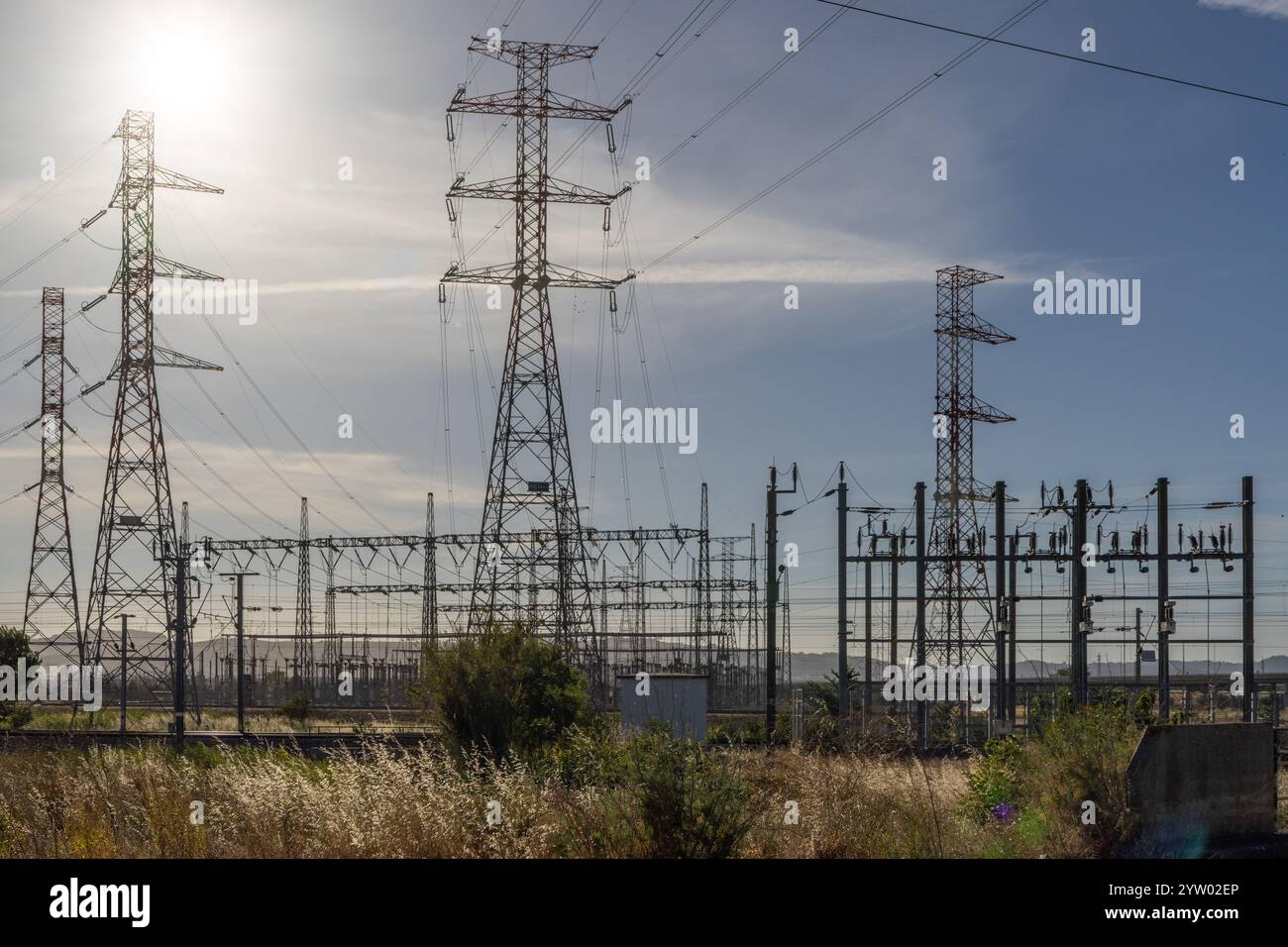 Electricity pylons and power lines create a powerful industrial scene ...