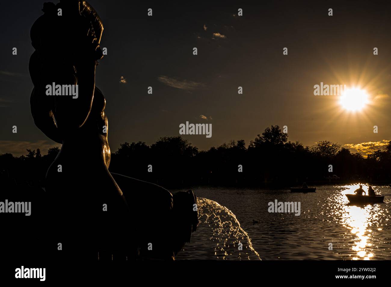 The sculpture is of a man sitting in a boat hi-res stock photography ...