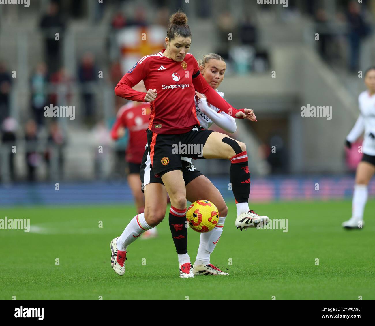 Dominique Janssen of Manchester United is put under pressure by Zara ...