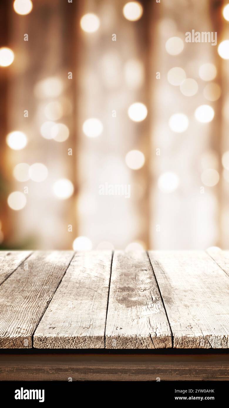 White rustic table with bokeh Christmas lights in the background, front ...