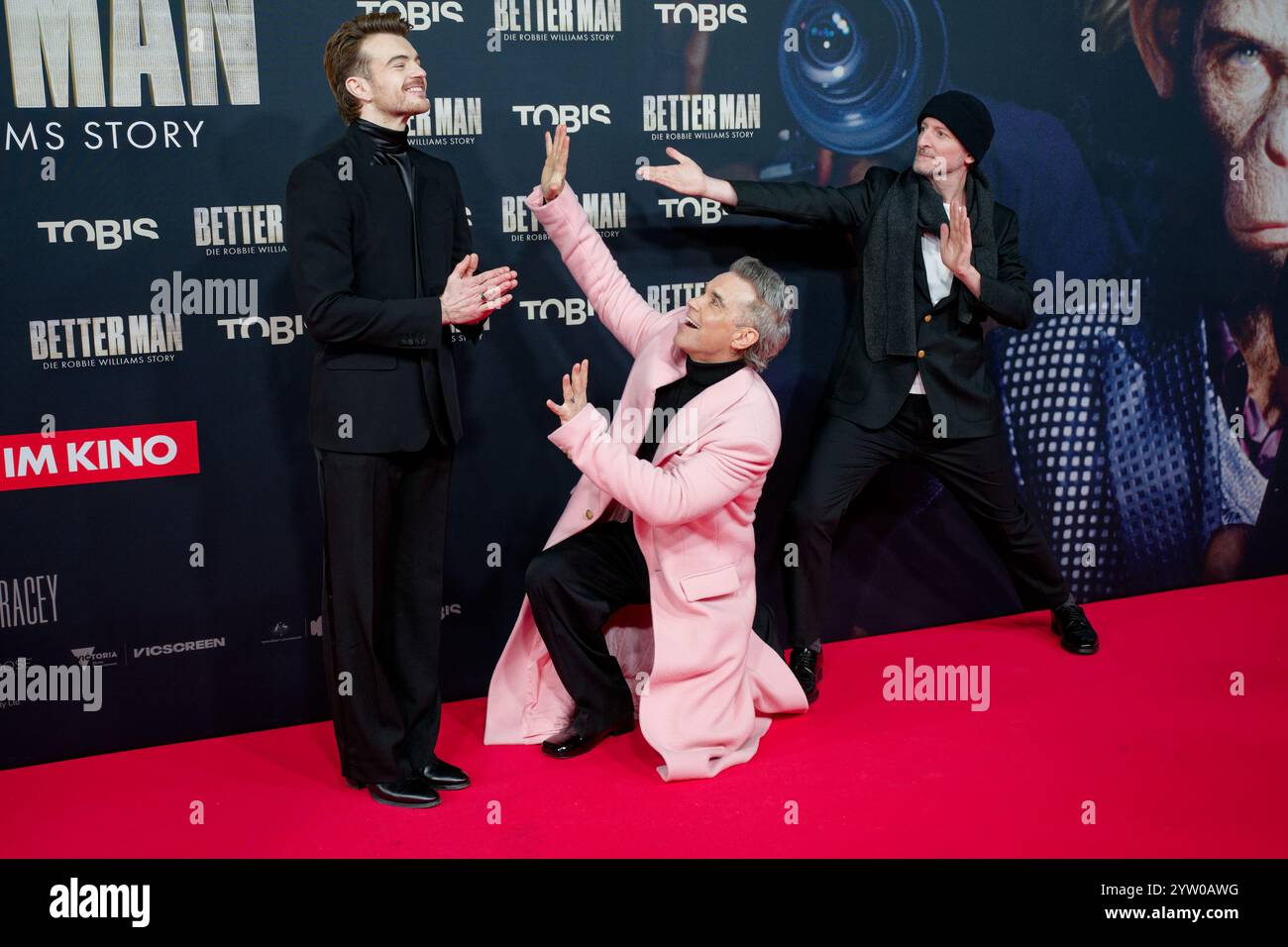 Cologne, Germany. 08th Dec, 2024. Actor Jonno Davies (l), singer Robbie ...