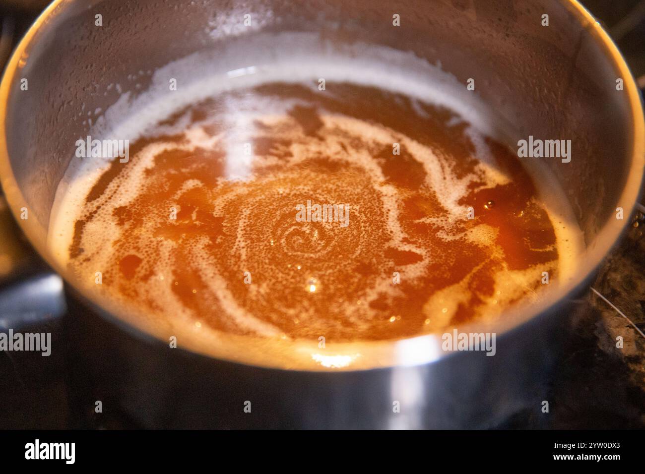 Making beef gravy swirling in a pot Stock Photo - Alamy