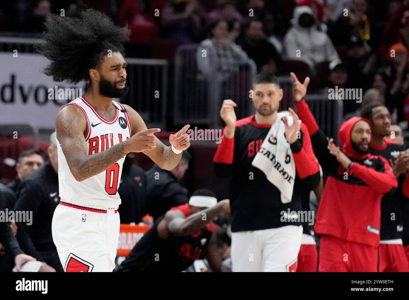 Chicago Bulls guard Coby White reacts after scoring a three-point shot ...