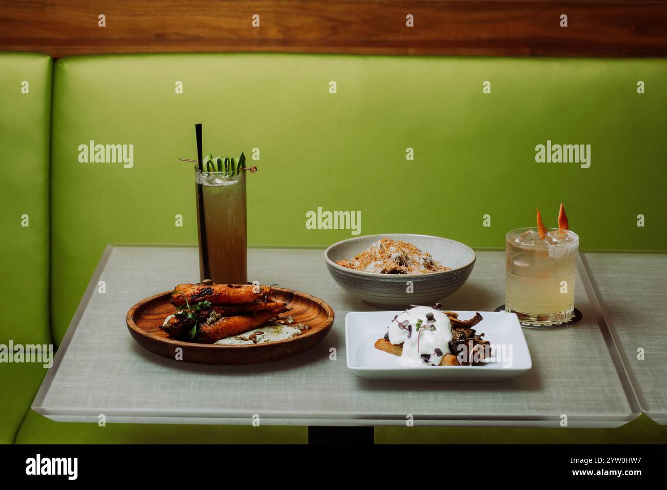A table with barbecue carrots, pork sugo pasta, and a mushroom tart ...