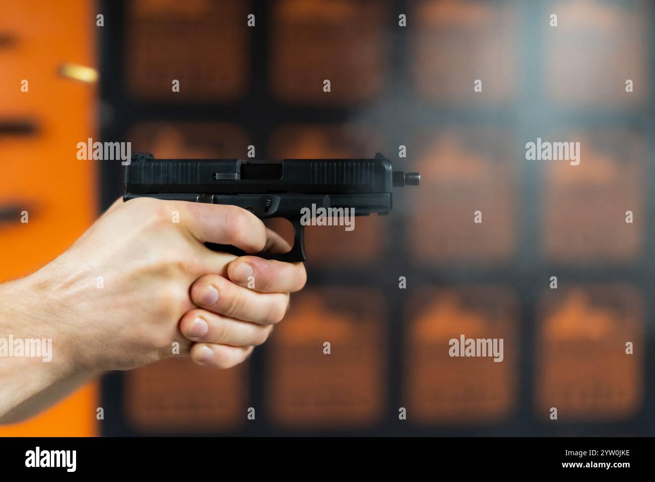 Shooting from a small caliber 22lr pistol at a shooting range Stock ...