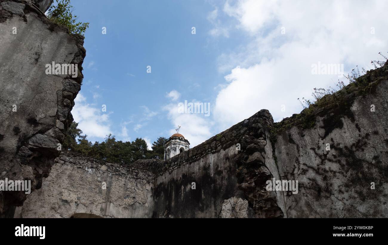 Visitors explore the remnants of an ancient structure, surrounded by ...