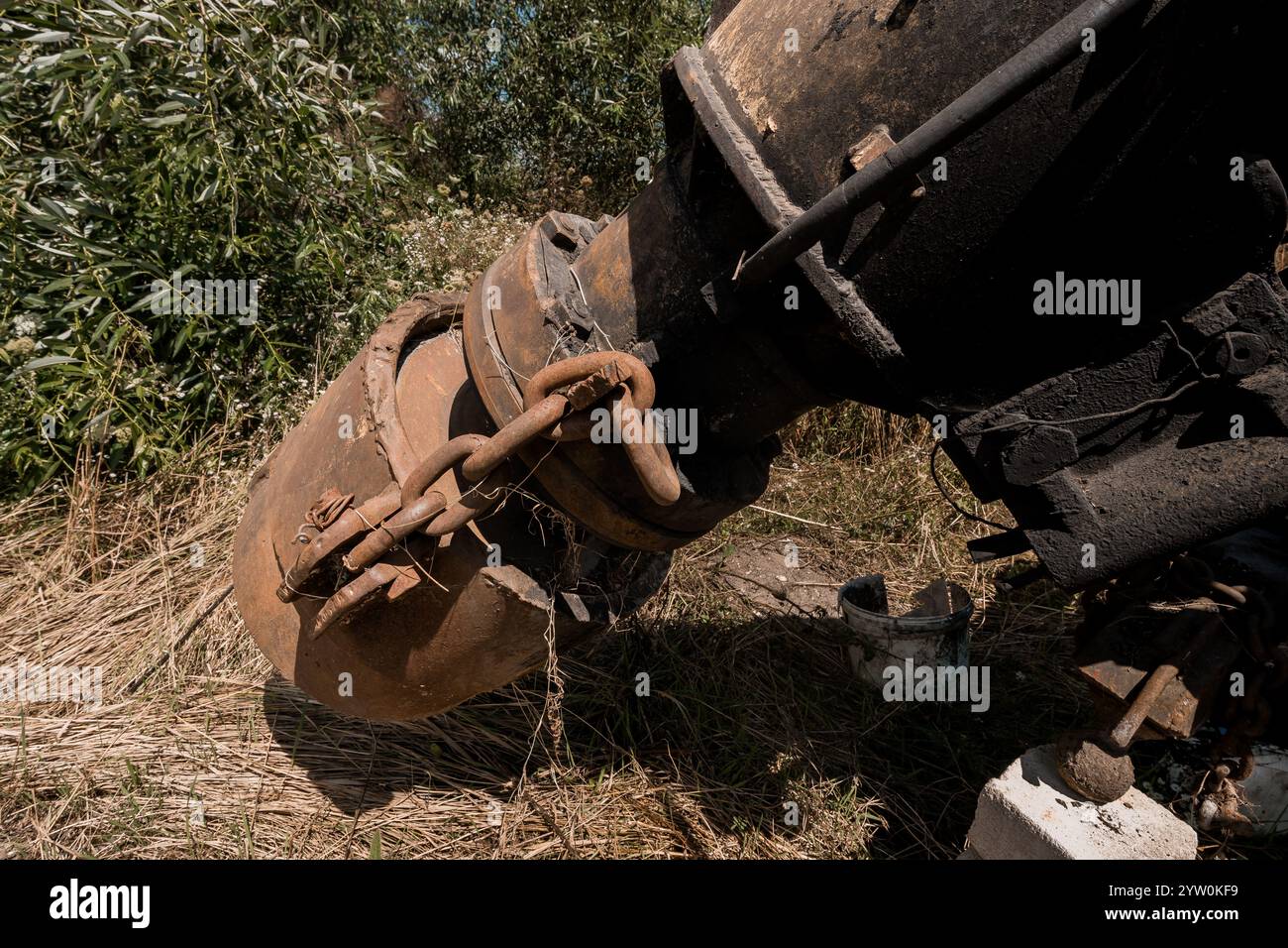 Rusty Industrial Machinery Surrounded by Overgrown Vegetation Stock ...