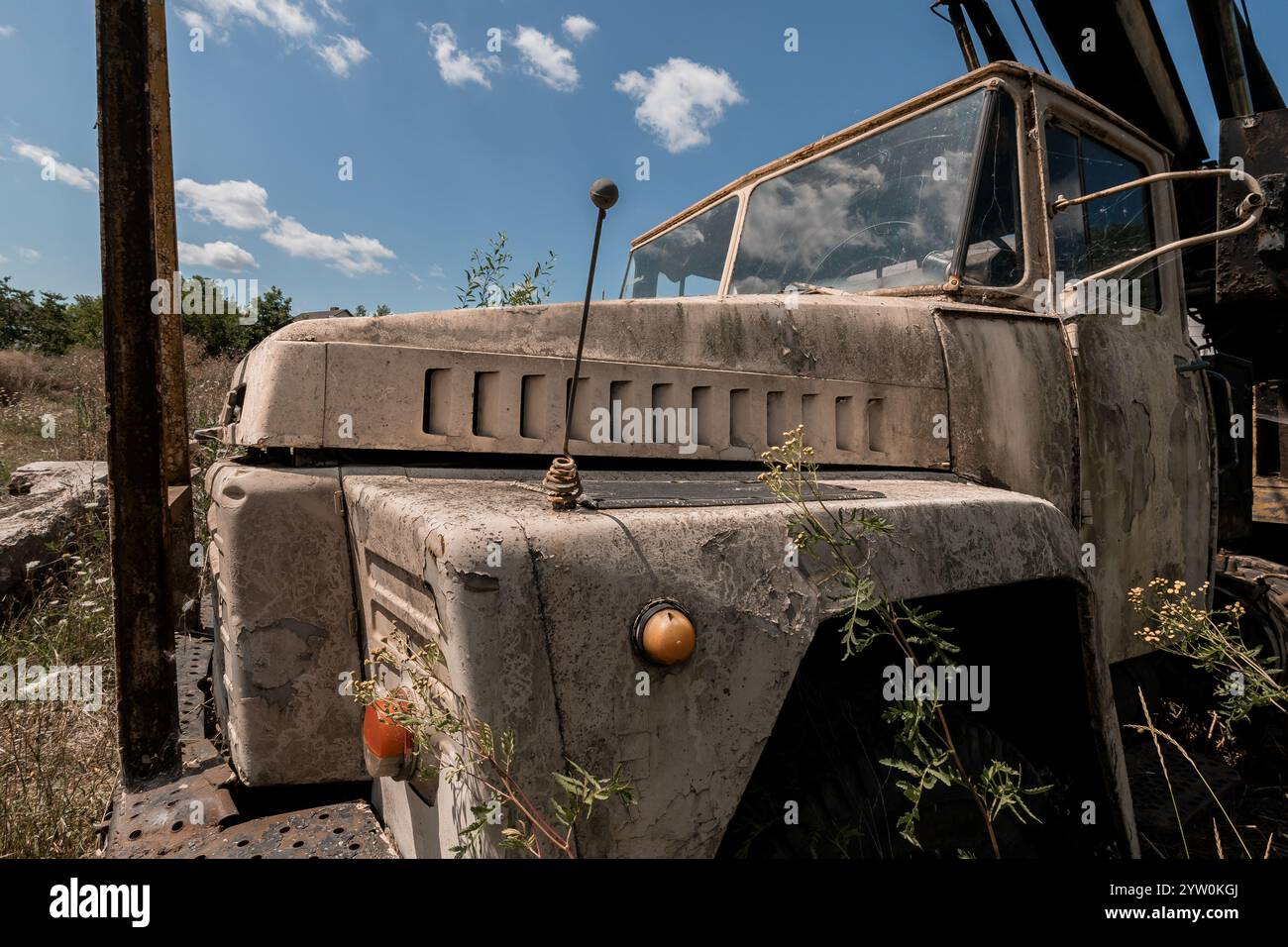 Abandoned Heavy Machinery in Overgrown Terrain Stock Photo - Alamy